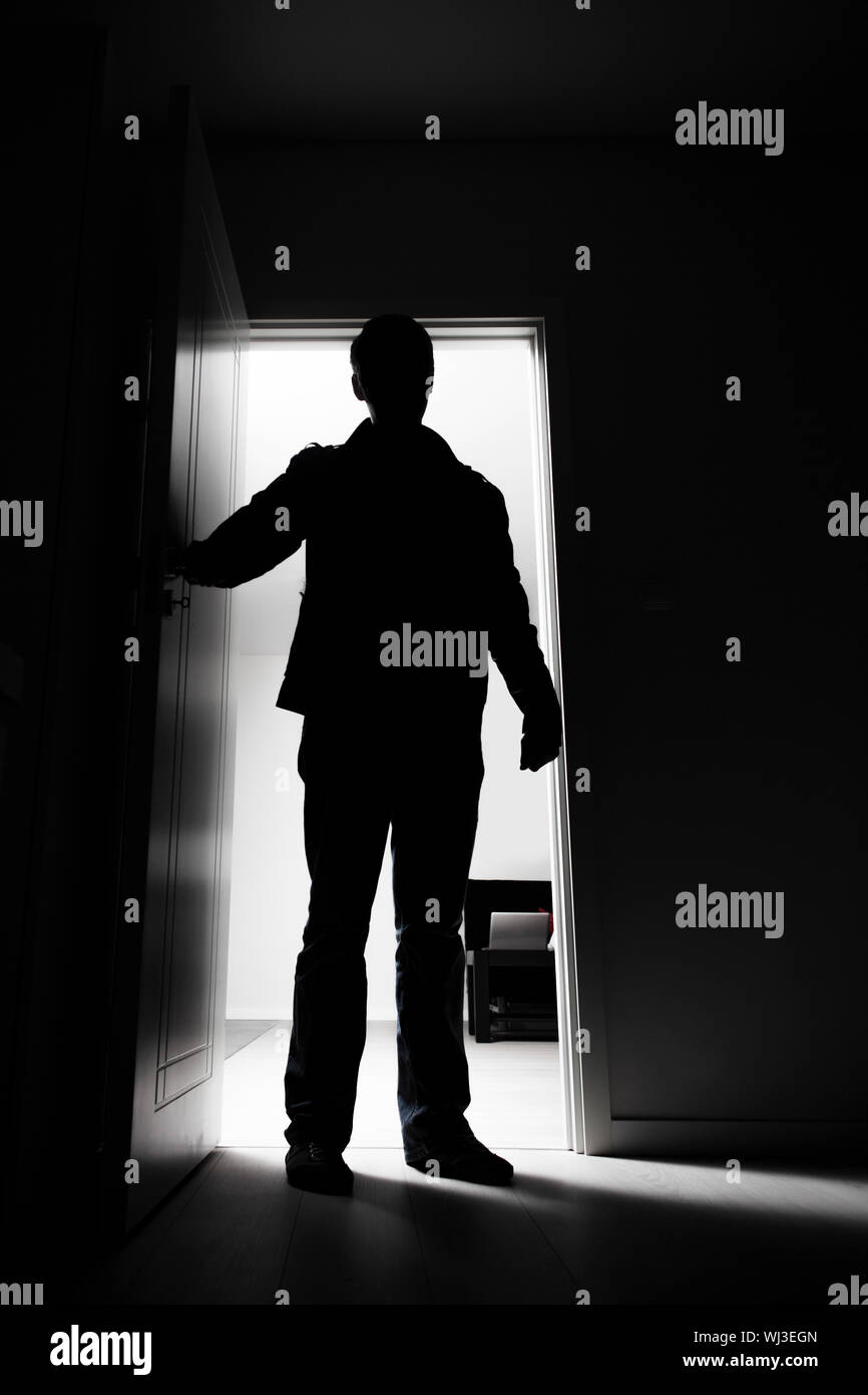 Burglar entering dark room hi-res stock photography and images - Alamy