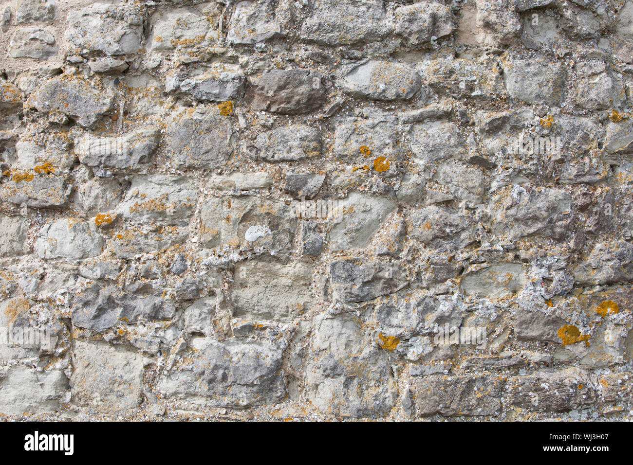 Close-up view of cobbled wall Stock Photo - Alamy
