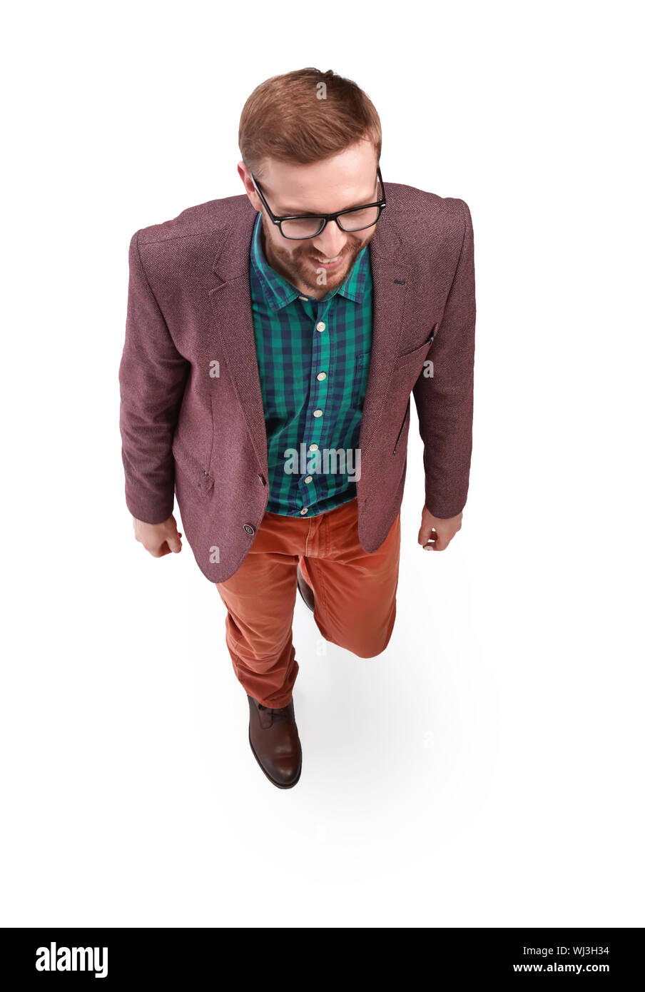 top view. smiling young man stepping forward Stock Photo - Alamy