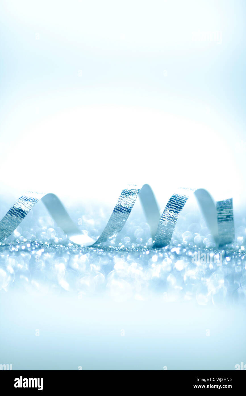 Decorative ribbon on shiny glitter background Stock Photo - Alamy