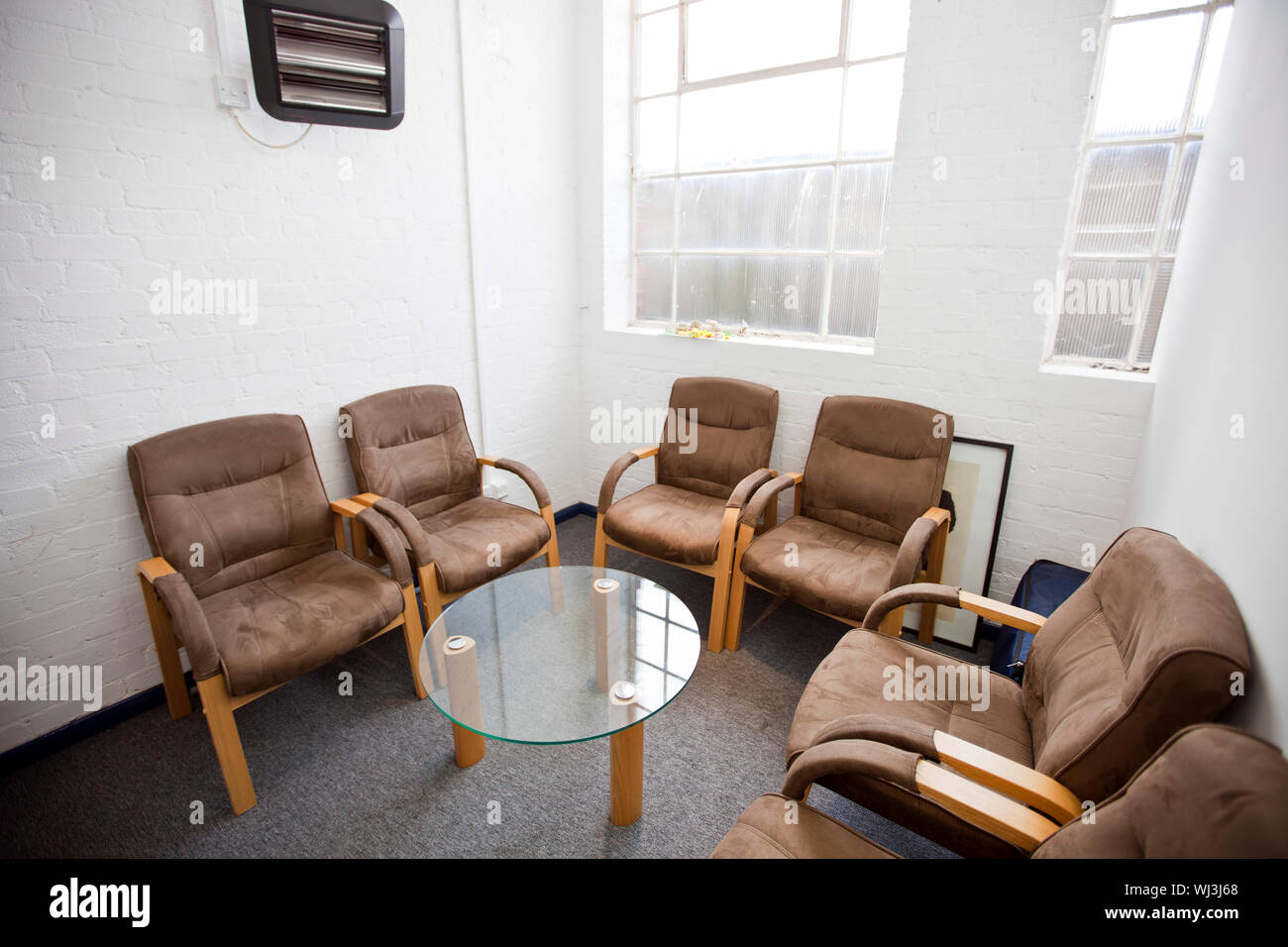 Interior of waiting room with chairs and table in television station ...