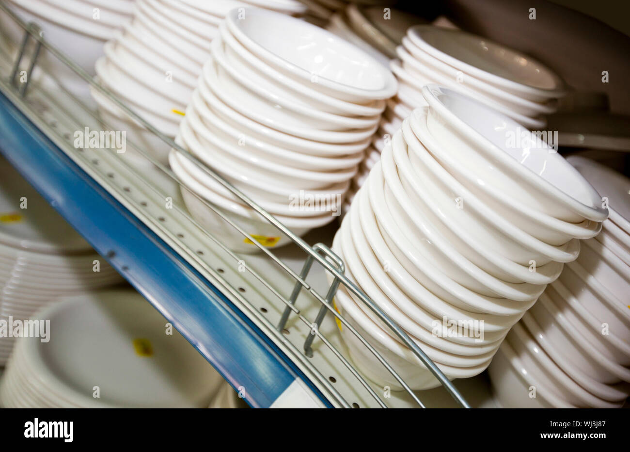 Kitchenware on shelf in supermarket Stock Photo - Alamy