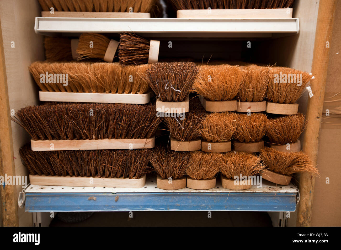 Stacked brushes in supermarket Stock Photo - Alamy