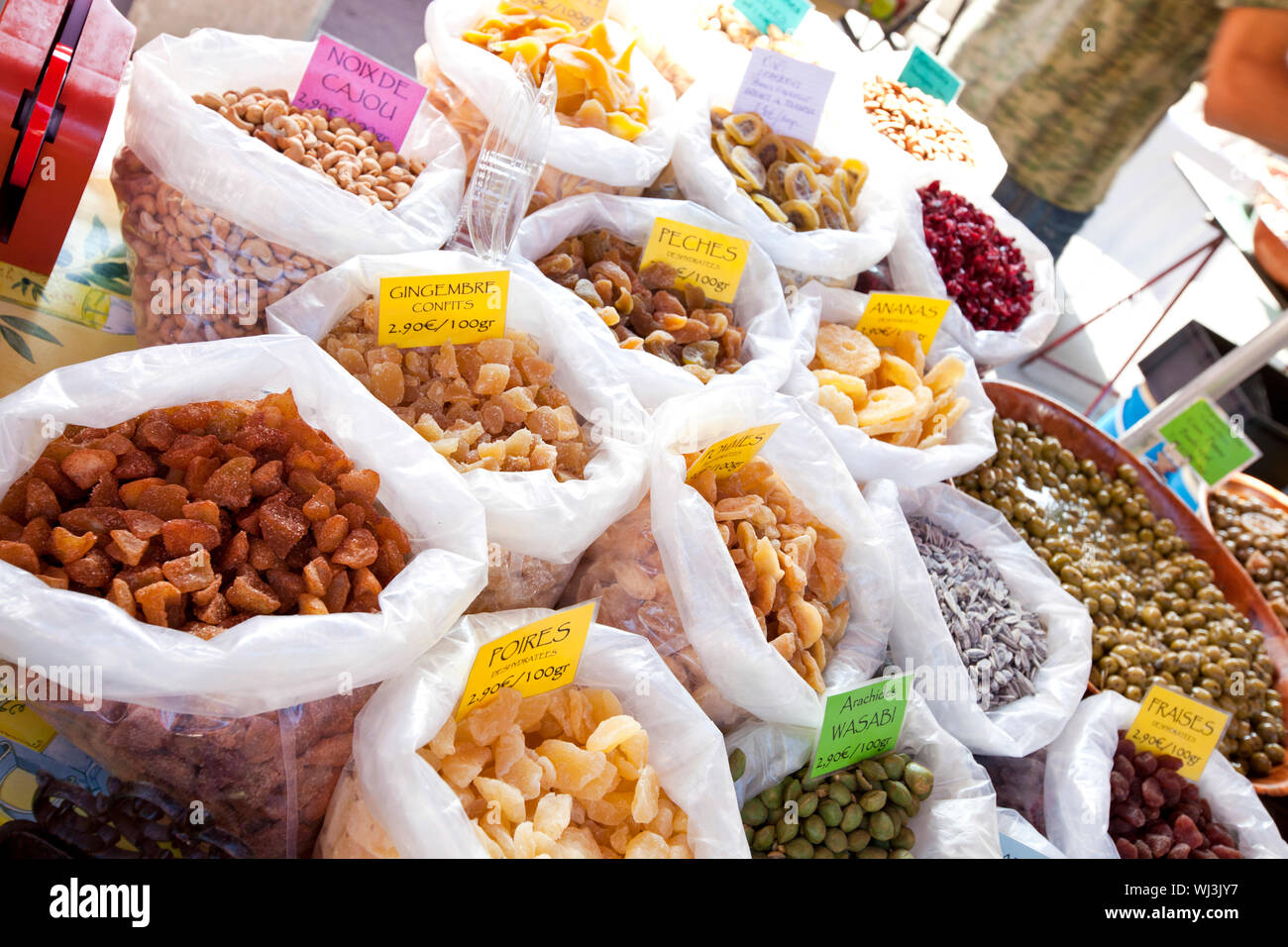 Variety of dried fruits on display in store Stock Photo - Alamy