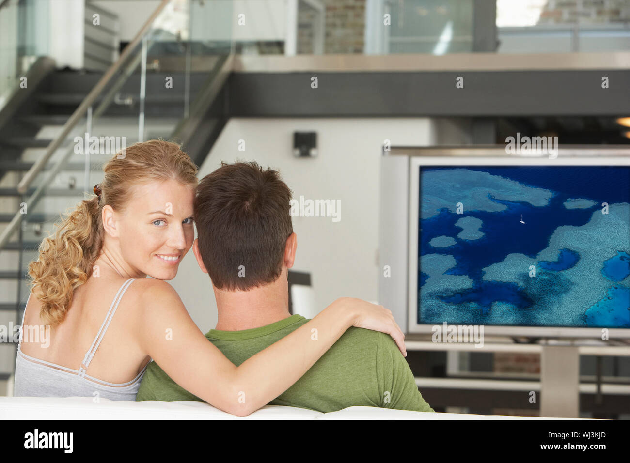 Woman back of head watching tv hi-res stock photography and images - Alamy