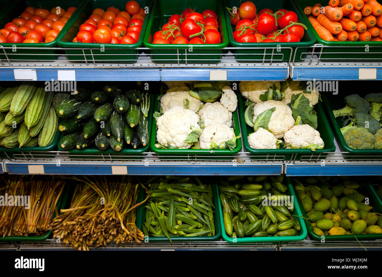 Variety of fresh vegetables on display in grocery store Stock Photo - Alamy