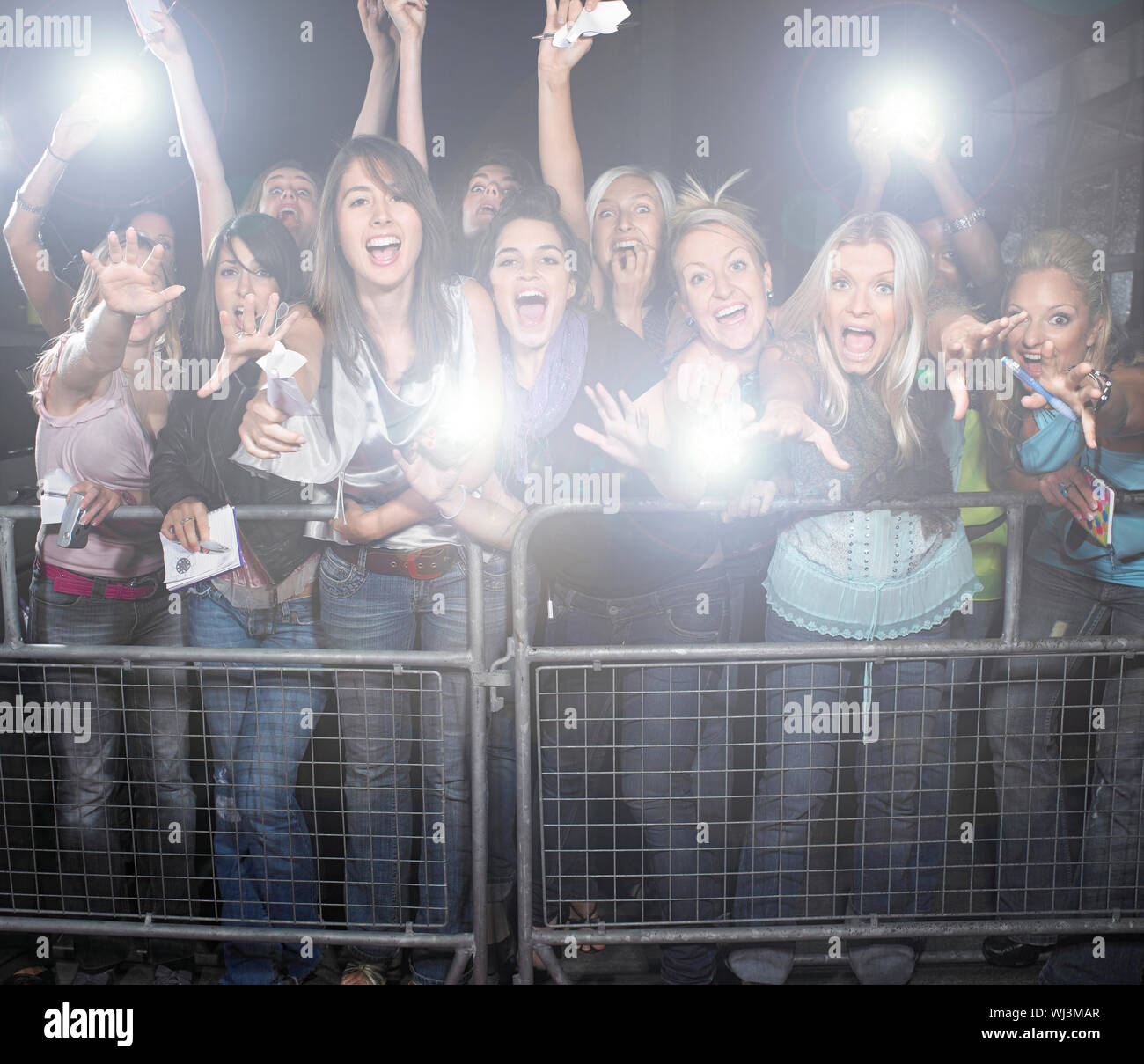 Crowd of young female fans screaming and cheering at concert Stock ...