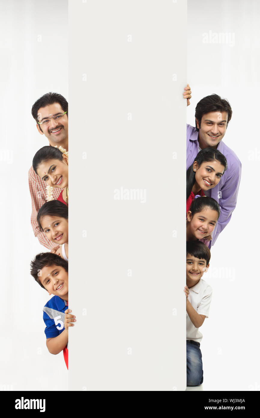 Boy hiding behind mother hi-res stock photography and images - Alamy