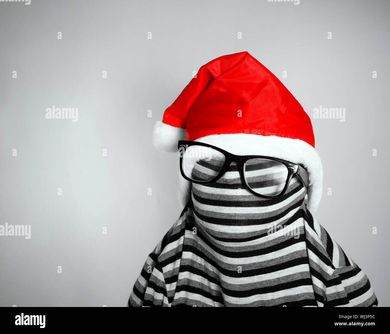 strange Santa Claus in a striped dress and glasses Stock Photo - Alamy