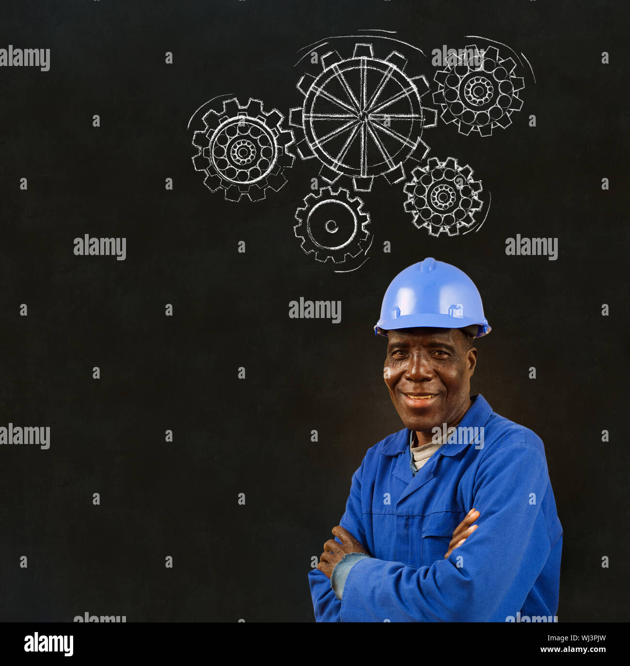 African American black man worker with chalk gears on a blackboard ...