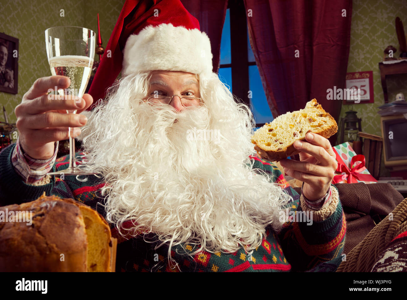 Portrait of Santa Claus celebrating with a glass of champagne and ...