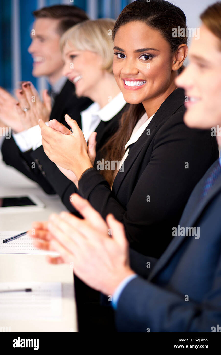Business people applauding in a meeting Stock Photo - Alamy
