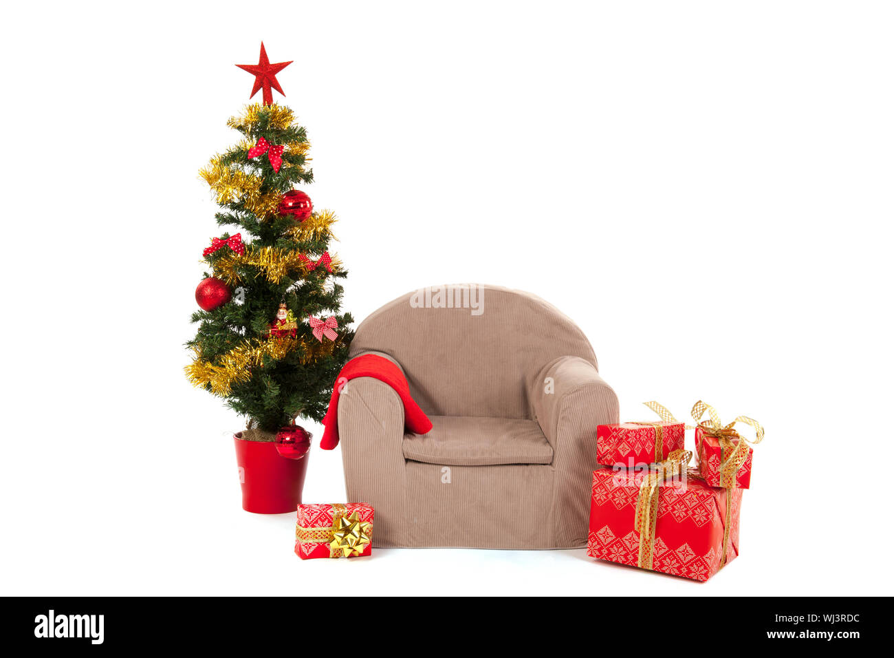Christmas interior with chair, tree and gifts Stock Photo - Alamy