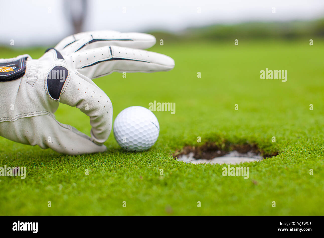 Man push ball in golf hi-res stock photography and images - Alamy
