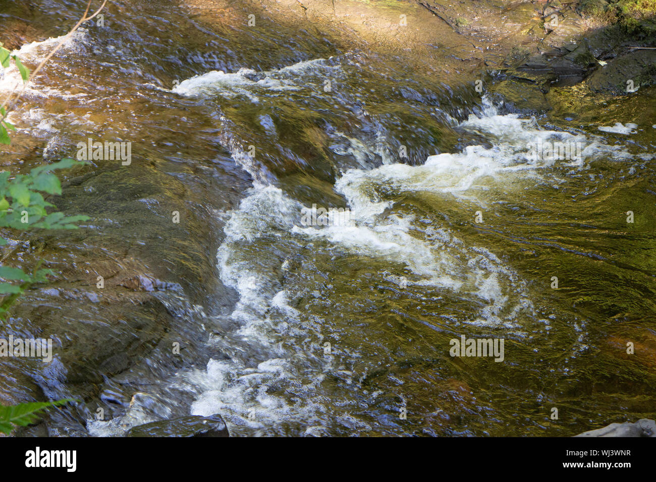 Water on a strems slope Stock Photo - Alamy