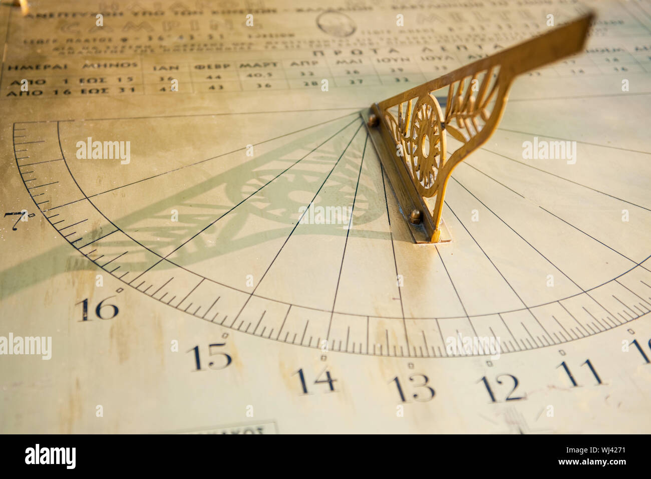 Gnomon as a clock with sun shadow Stock Photo - Alamy