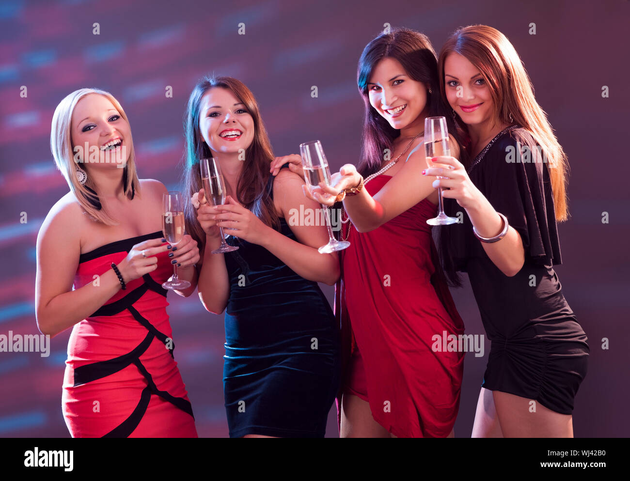 Four female friends partying in hi-res stock photography and images - Alamy