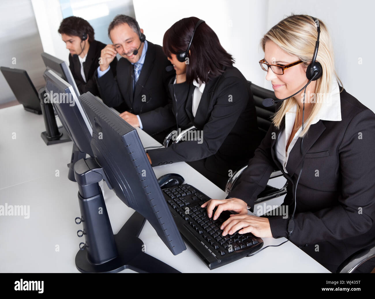 Group of young business customer service people Stock Photo - Alamy