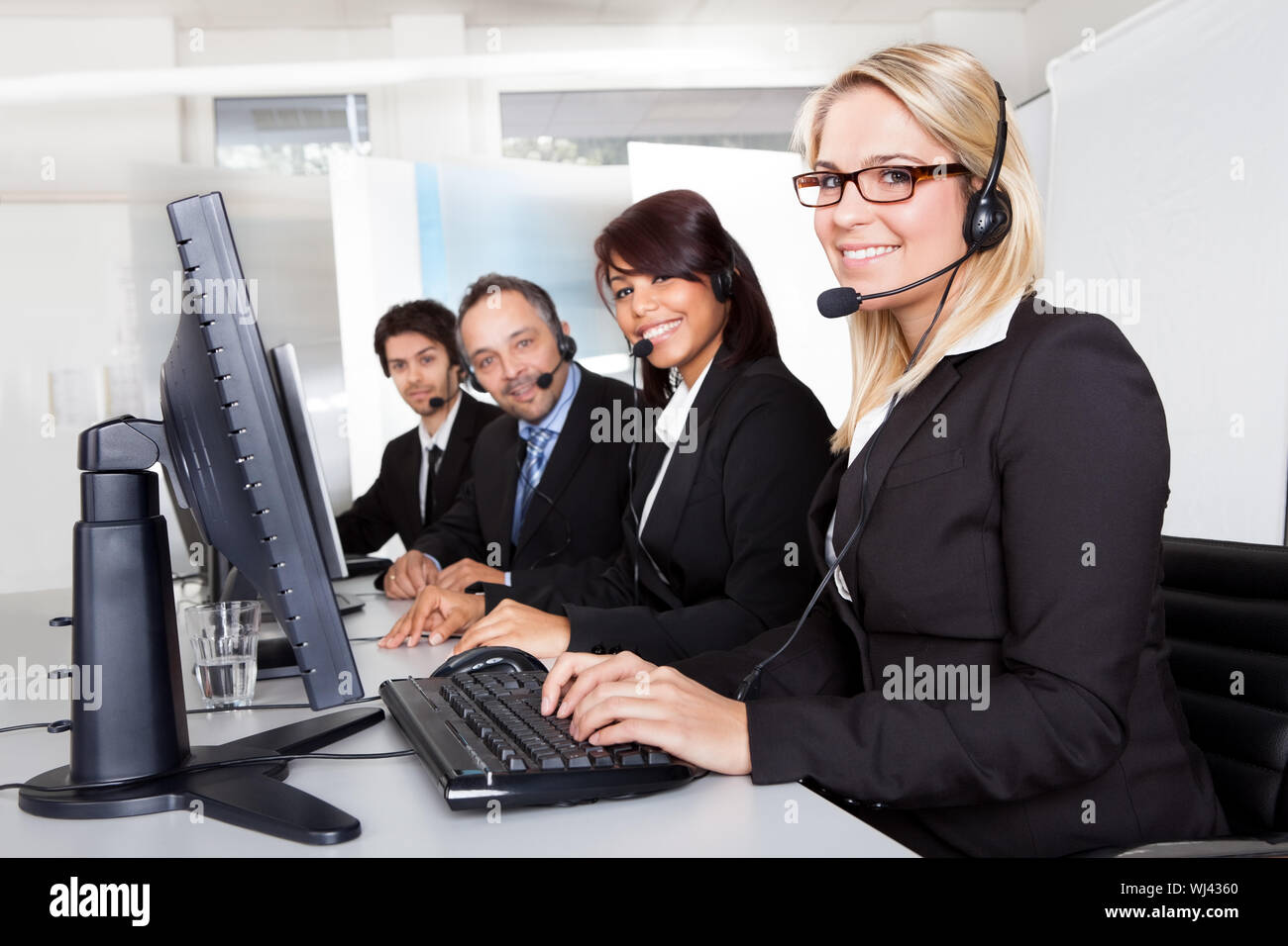 Group of young business customer service people Stock Photo - Alamy