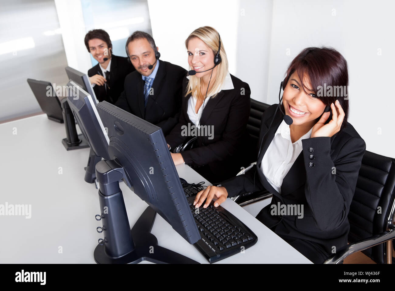 Group of young business customer service people Stock Photo - Alamy