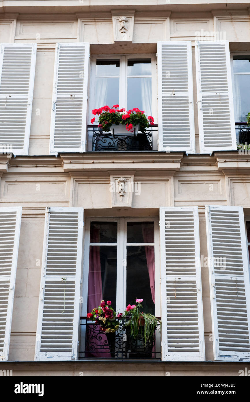 Typical French windows with balconies and blinds in Paris Stock Photo ...