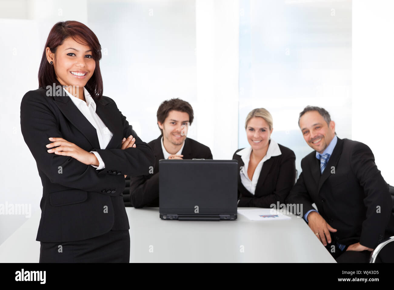 Portrait successful business woman and her team Stock Photo - Alamy