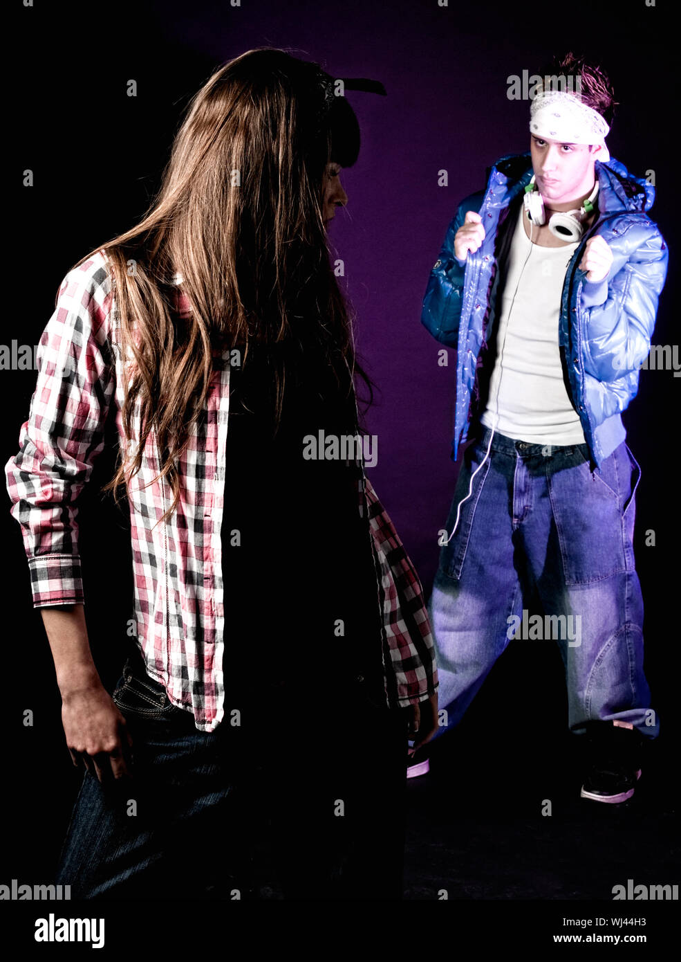 Young hip-hop man try to pick up a girl at disco on high contrast Stock ...