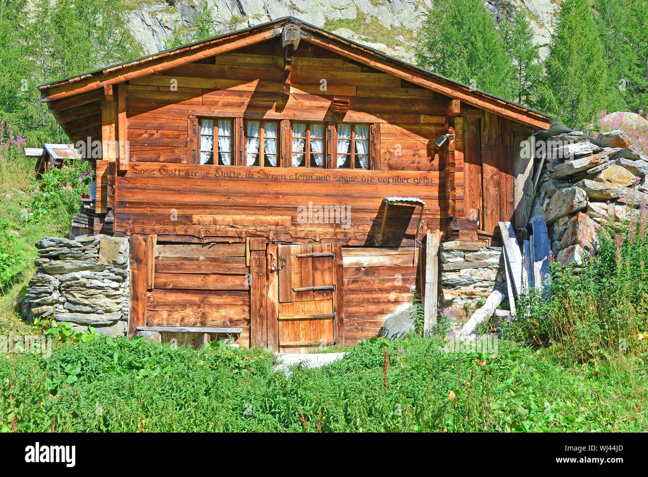 Traditional Swiss Mountain chalet in a mountain summer hamlet with a ...