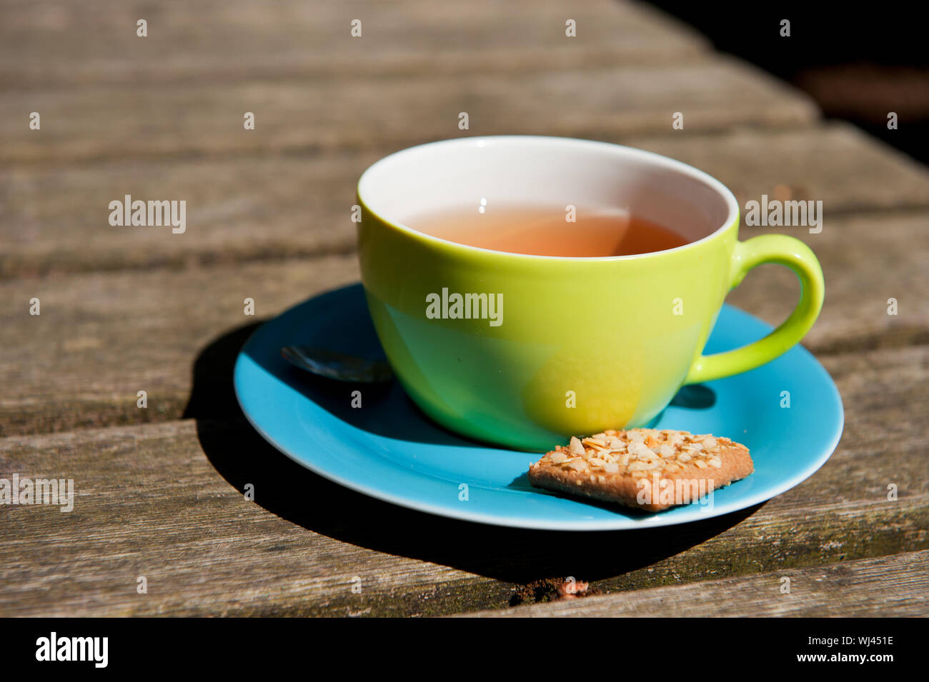 cup of tea in colorful crockery outdoor Stock Photo - Alamy