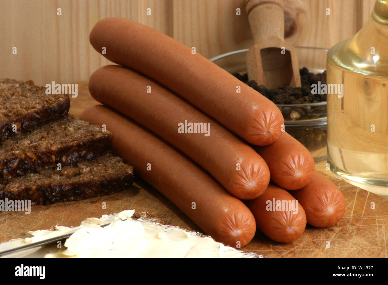 sausage, also known as knackwurst, on a timber board Stock Photo - Alamy