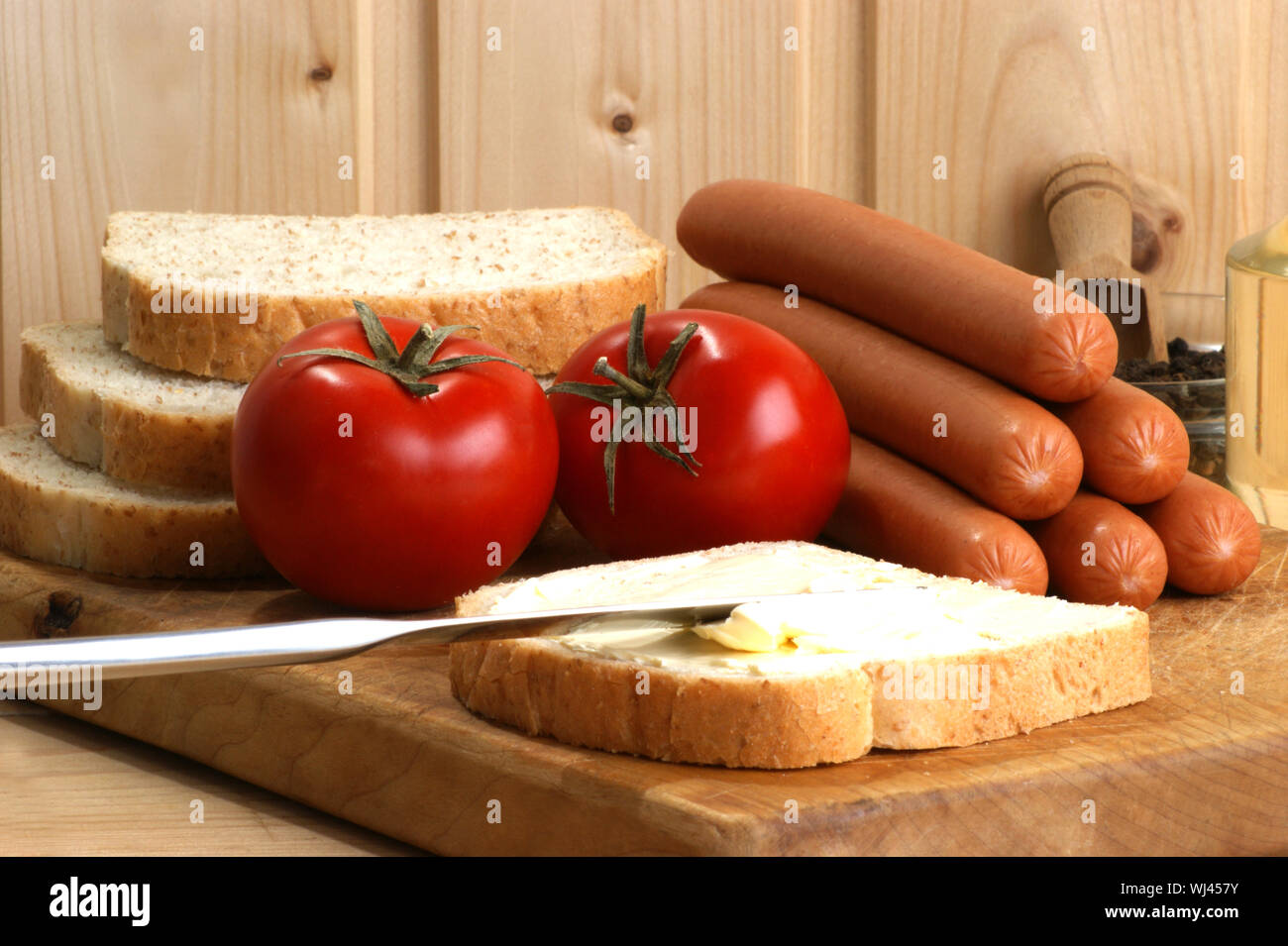 sausage, also known as knackwurst, on a timber board Stock Photo - Alamy