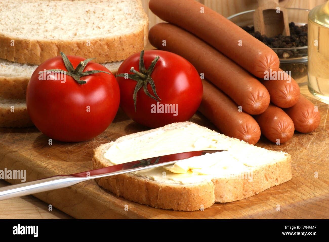 sausage, also known as knackwurst, on a timber board Stock Photo - Alamy