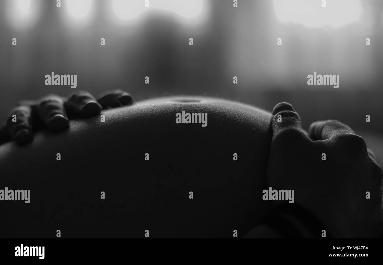 Hands on abdomen hi-res stock photography and images - Alamy