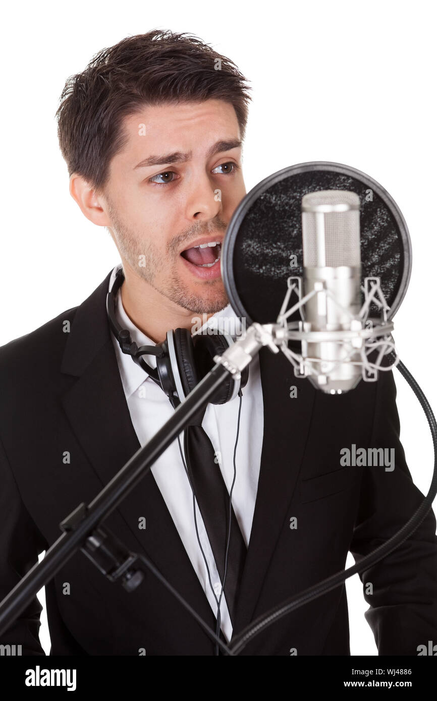 Young singer and microphone. Isolated on white Stock Photo - Alamy