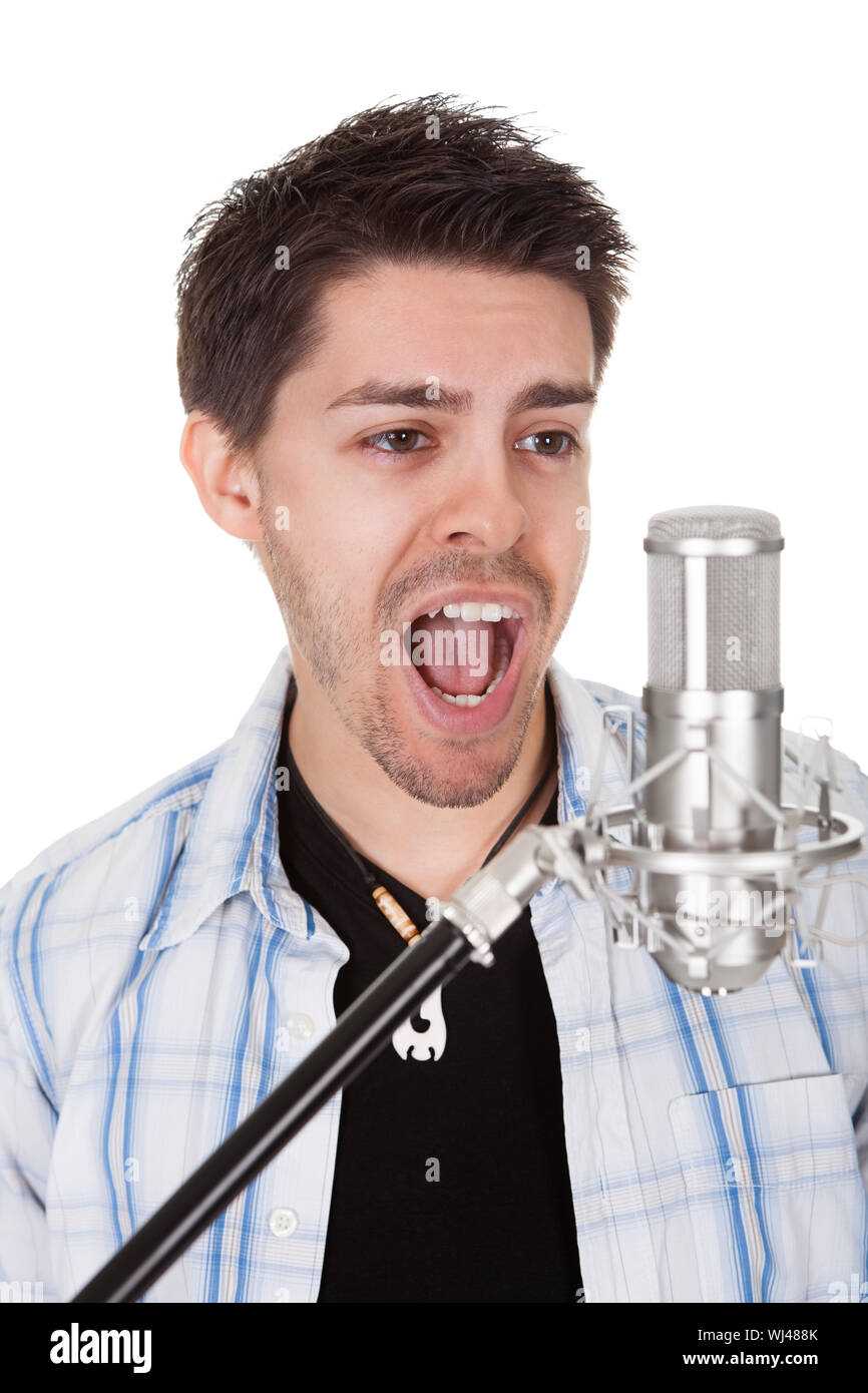 Young singer and microphone. Isolated on white Stock Photo - Alamy