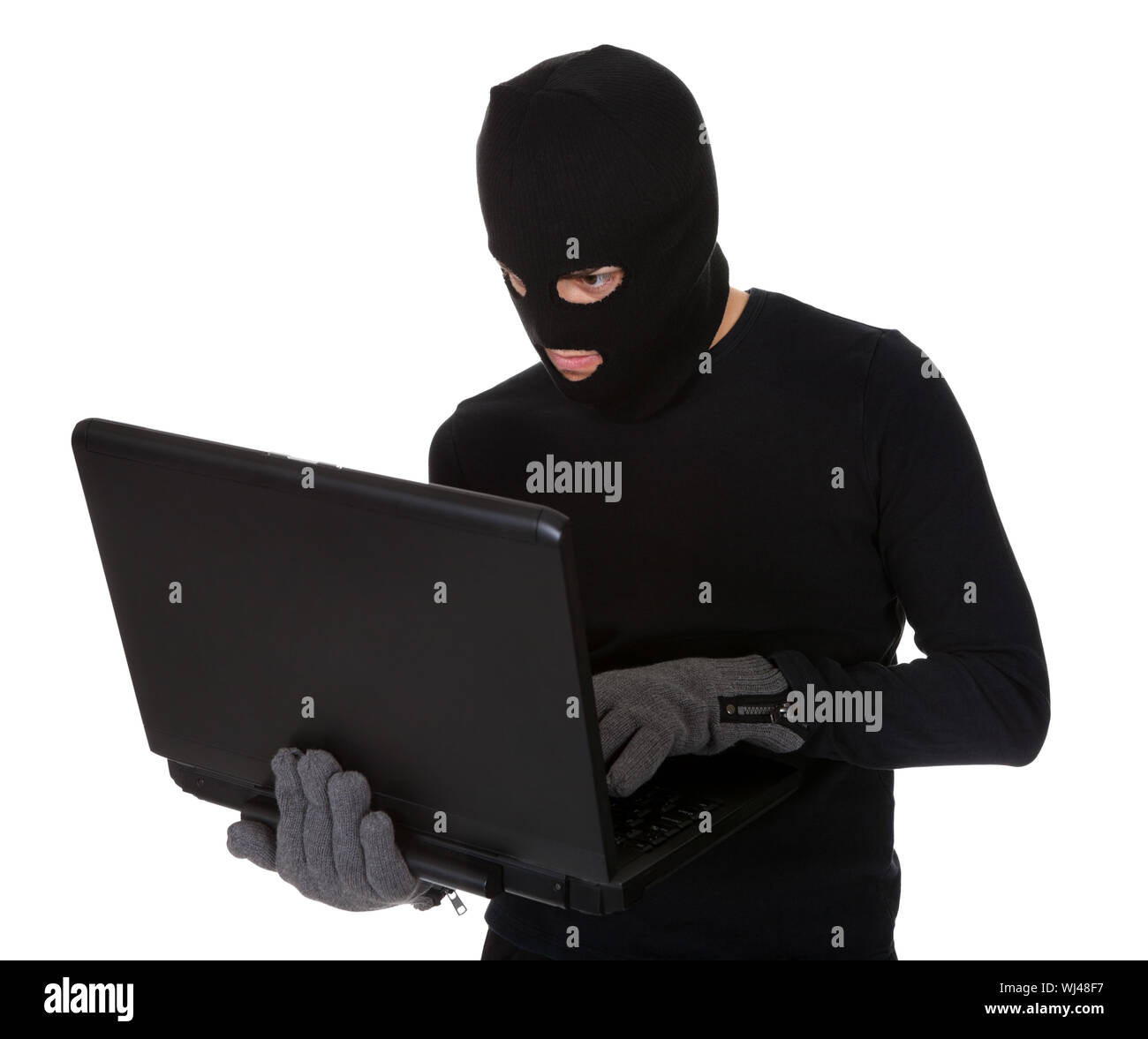 Thief in disguise stealing data from computer Stock Photo - Alamy