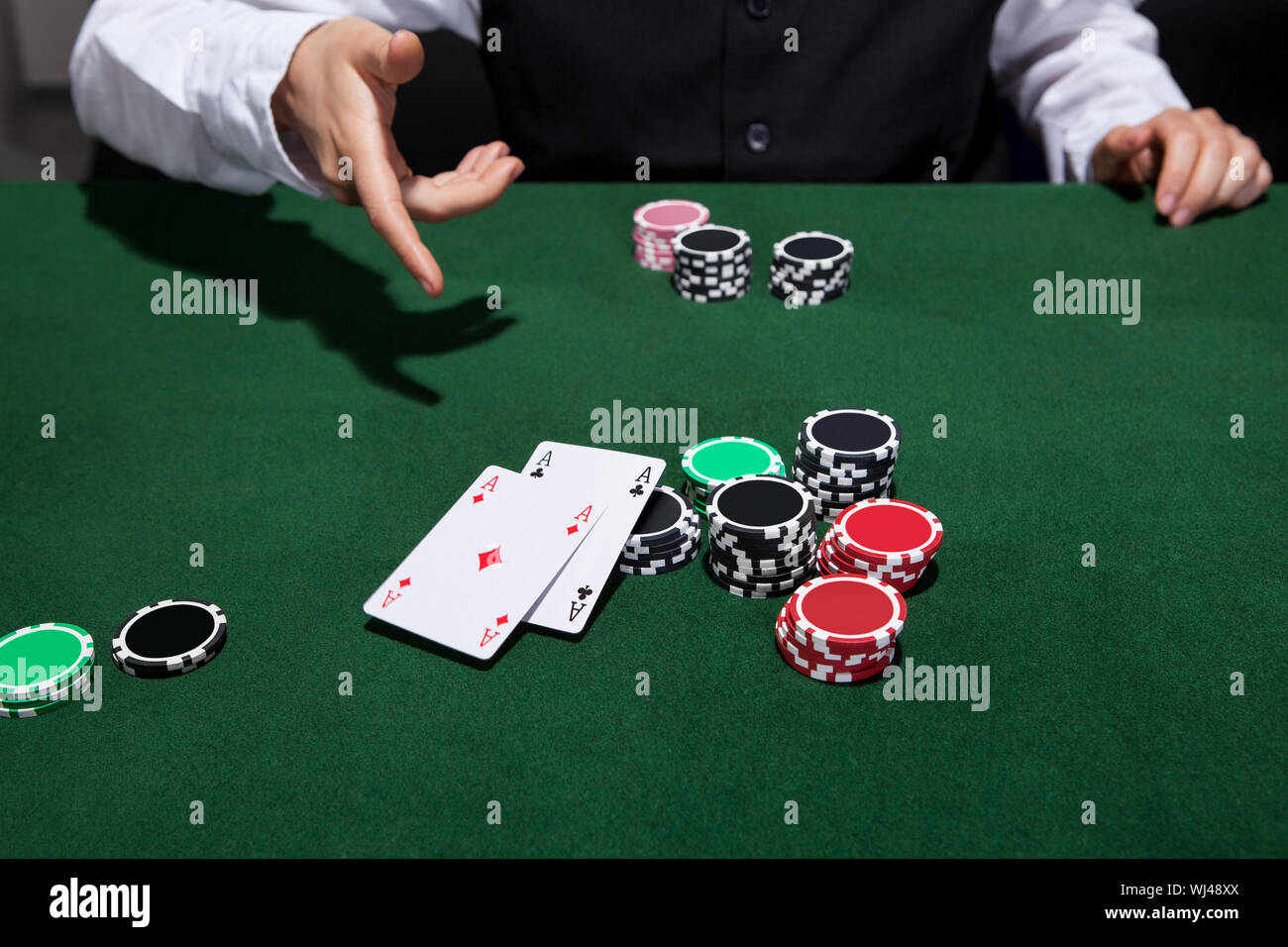 Player hand throwing pair aces hi-res stock photography and images - Alamy