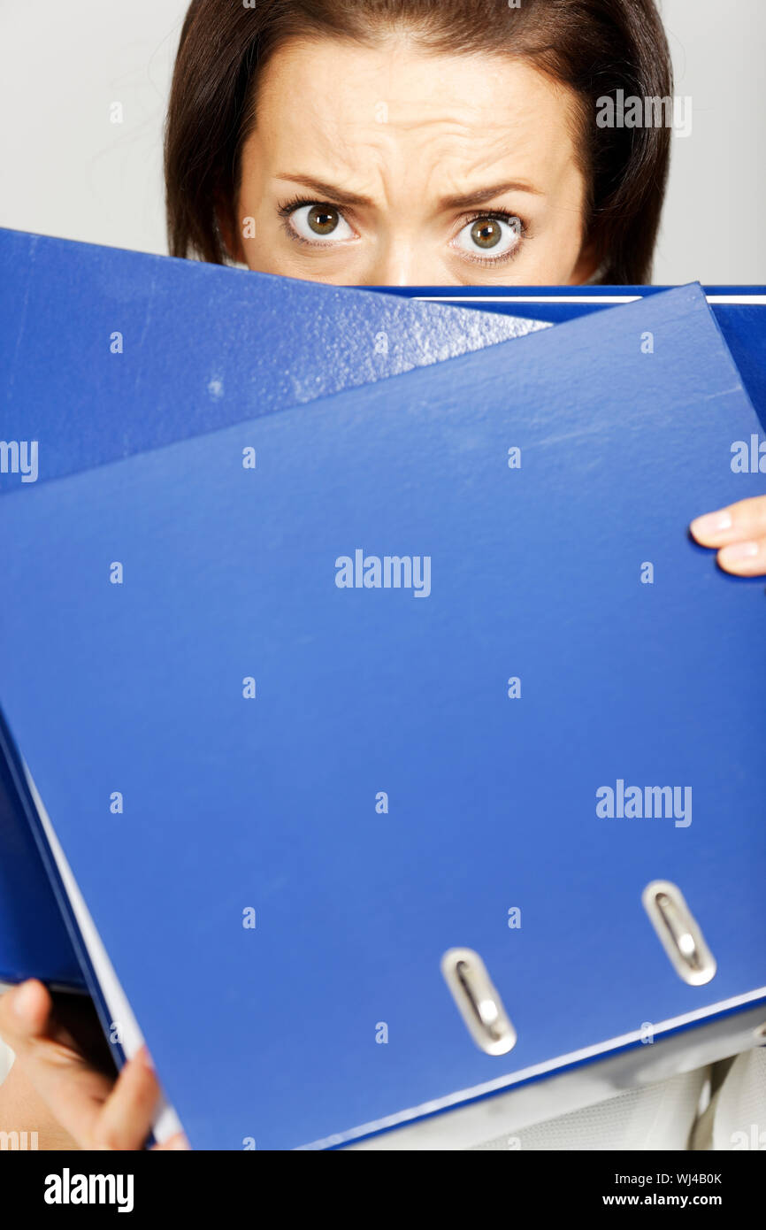 Business woman with too many folders Stock Photo - Alamy