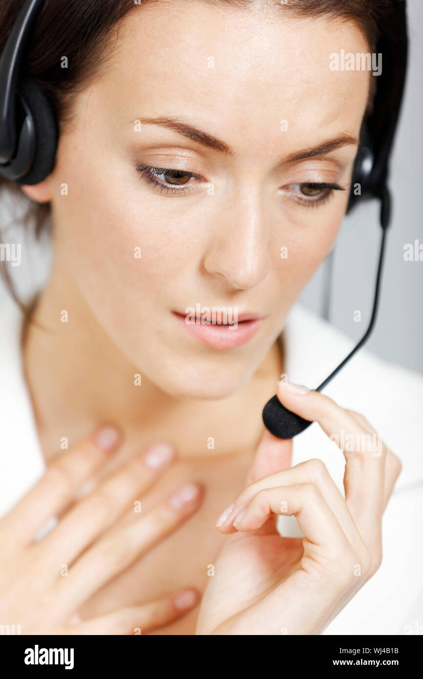 Call centre lady expressing concern and worry Stock Photo - Alamy