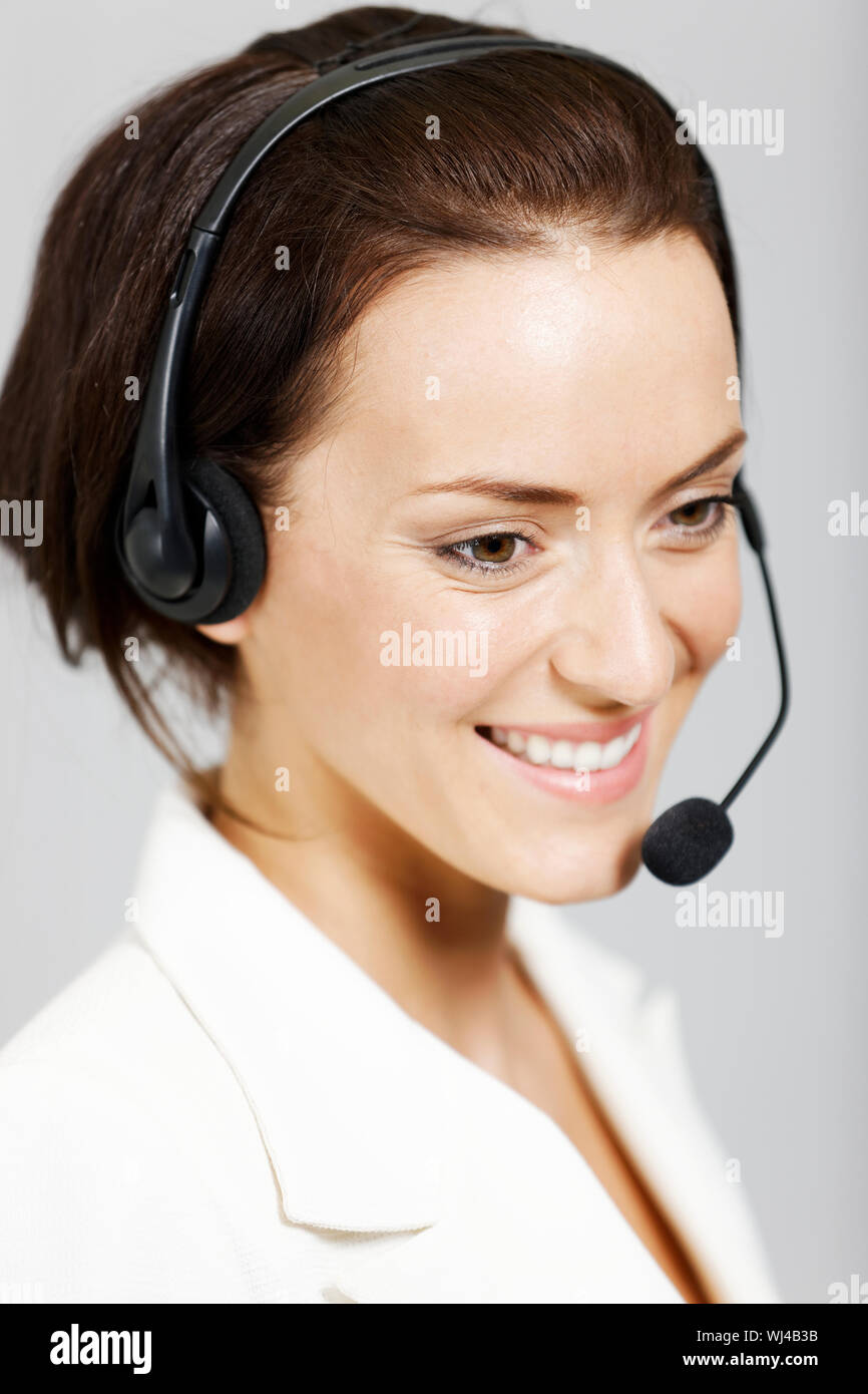 Happy call centre lady with telephone headset Stock Photo - Alamy
