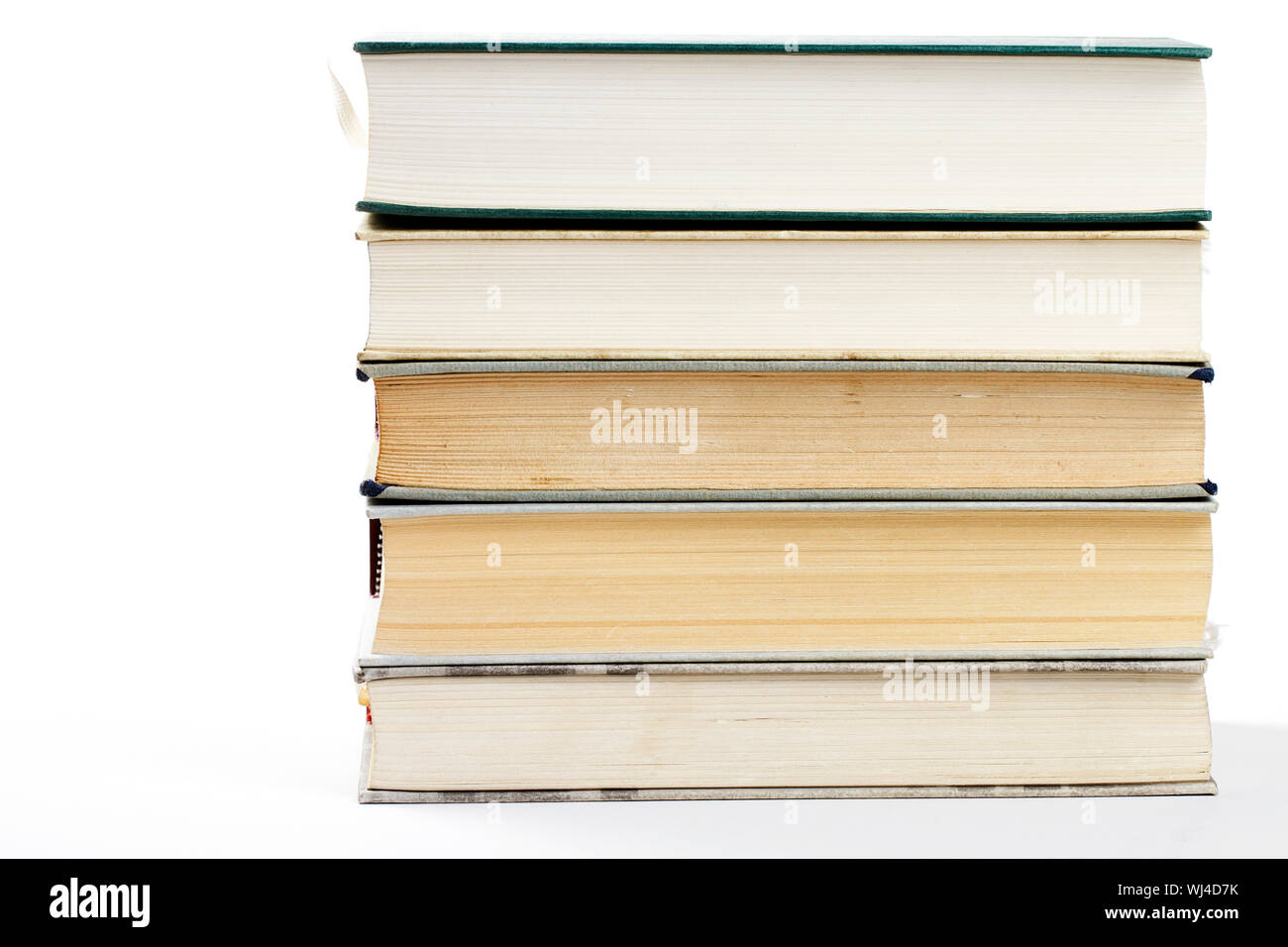 a stack of five books on white background Stock Photo - Alamy