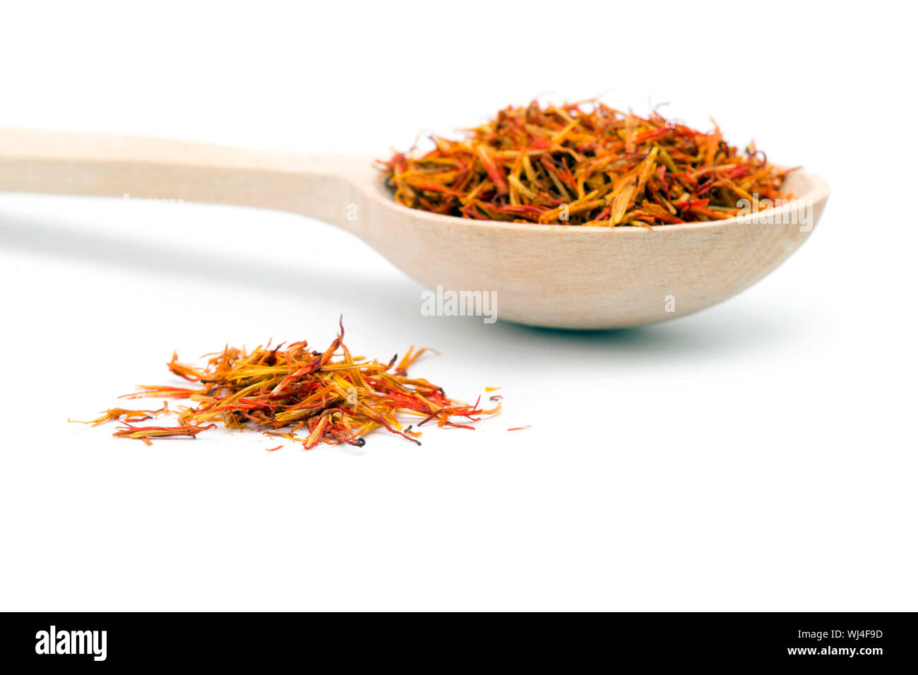 saffron spice in wooden spoon isolation white background Stock Photo ...