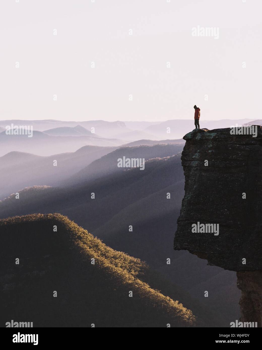 Standing at the edge of a mountain hi-res stock photography and images ...