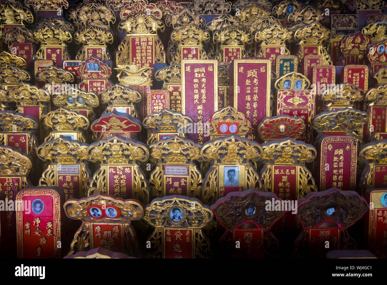 Beautiful gold and red ancestral memorial tablets at the Chinese temple ...