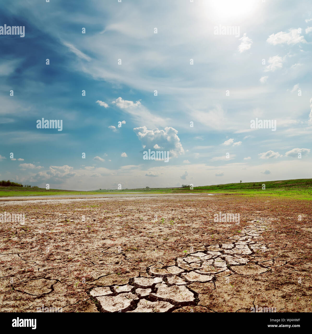 cloudy sky over drought land Stock Photo - Alamy