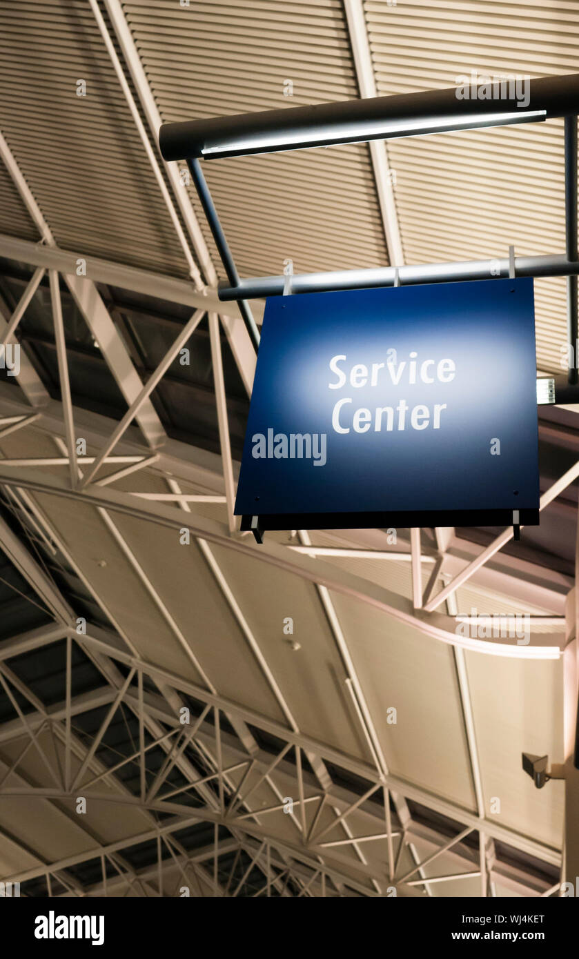 Blue Signage Marks the Customer Service Center in a Public Building ...