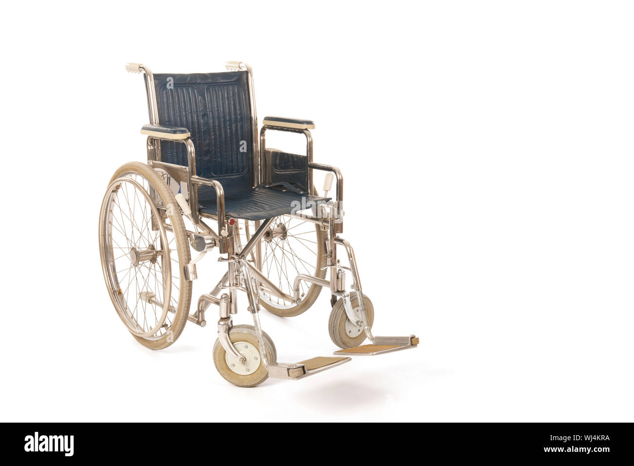 Empty wheelchair isolated over white background Stock Photo - Alamy