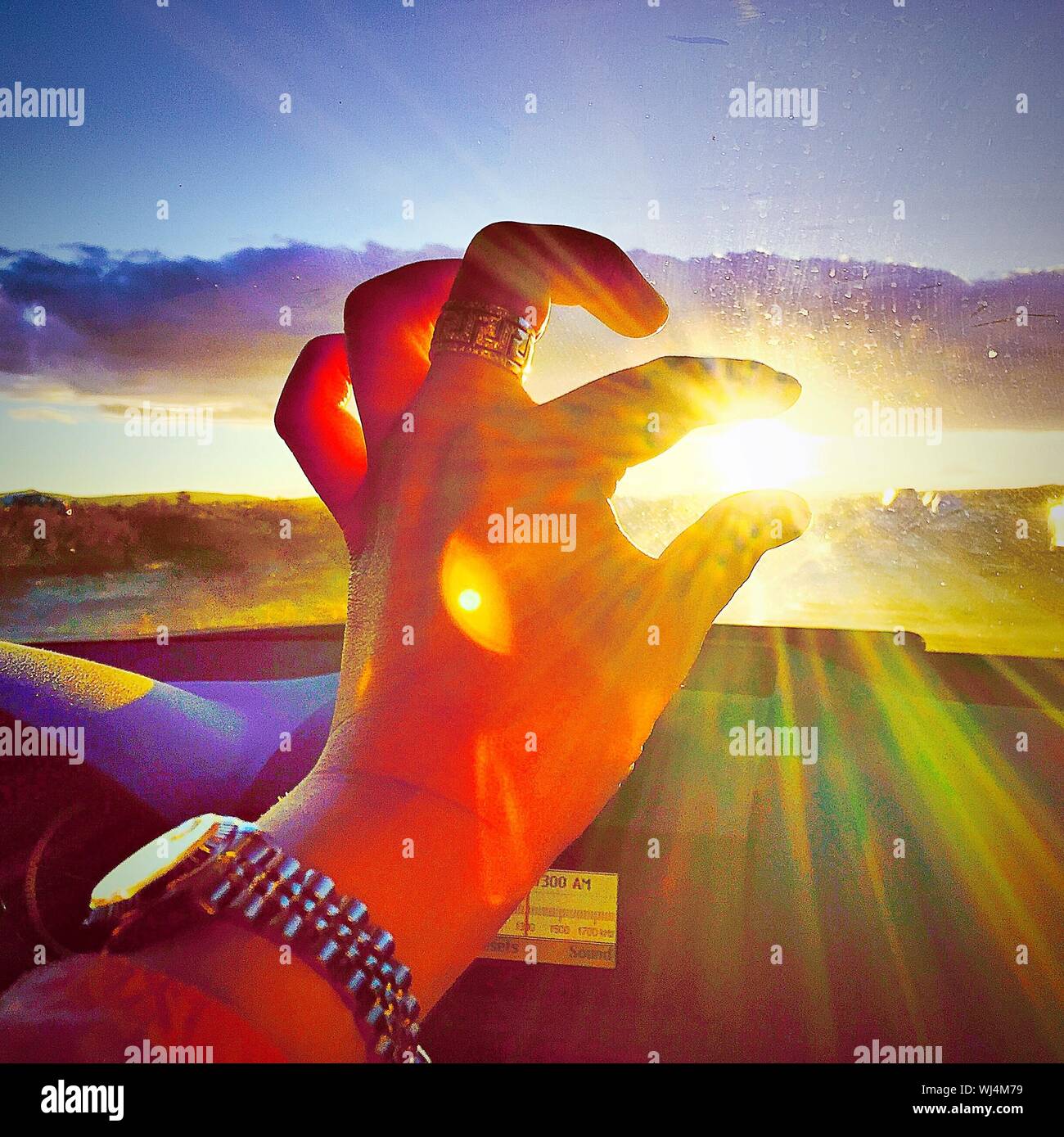 Optical illusion hand holding sun hi-res stock photography and images ...