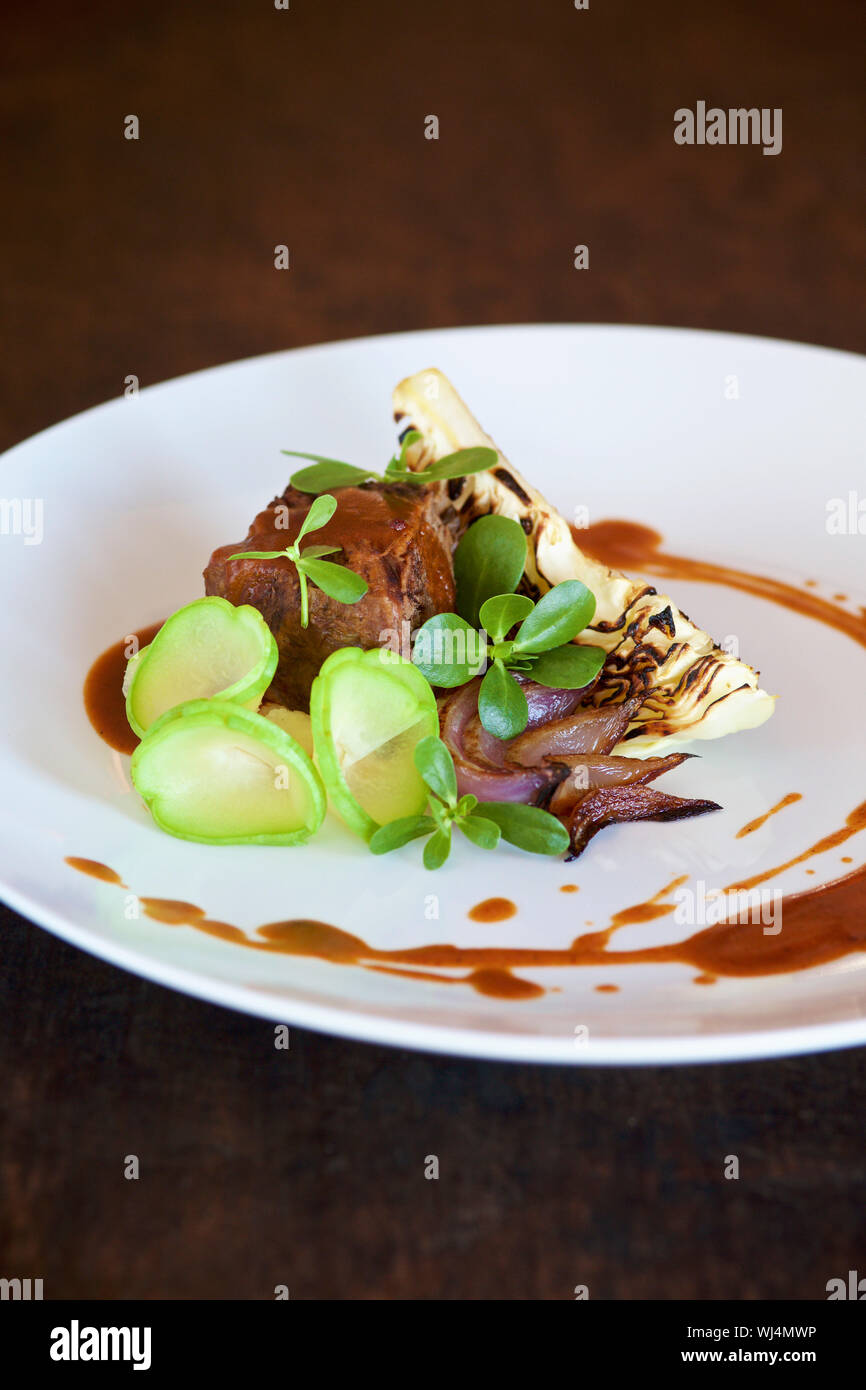 Close up gourmet grilled shallot and beef appetizer Stock Photo - Alamy