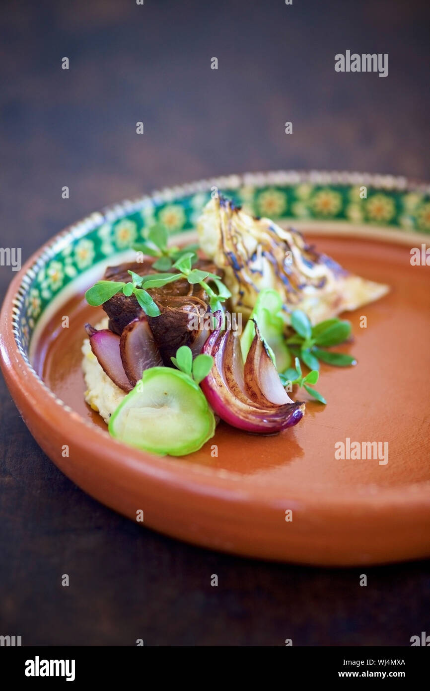 Close up gourmet, grilled shallot and beef appetizer Stock Photo - Alamy